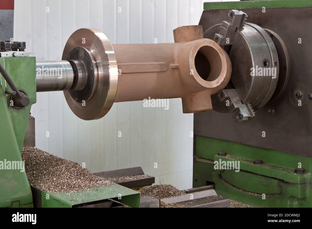Cnc lathe machine with lathe and milling tool. Turning an industrial part for a fire hydran ...