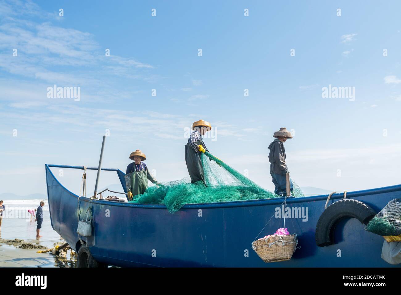 Fish farmer pulling fish in net hi-res stock photography and images - Alamy