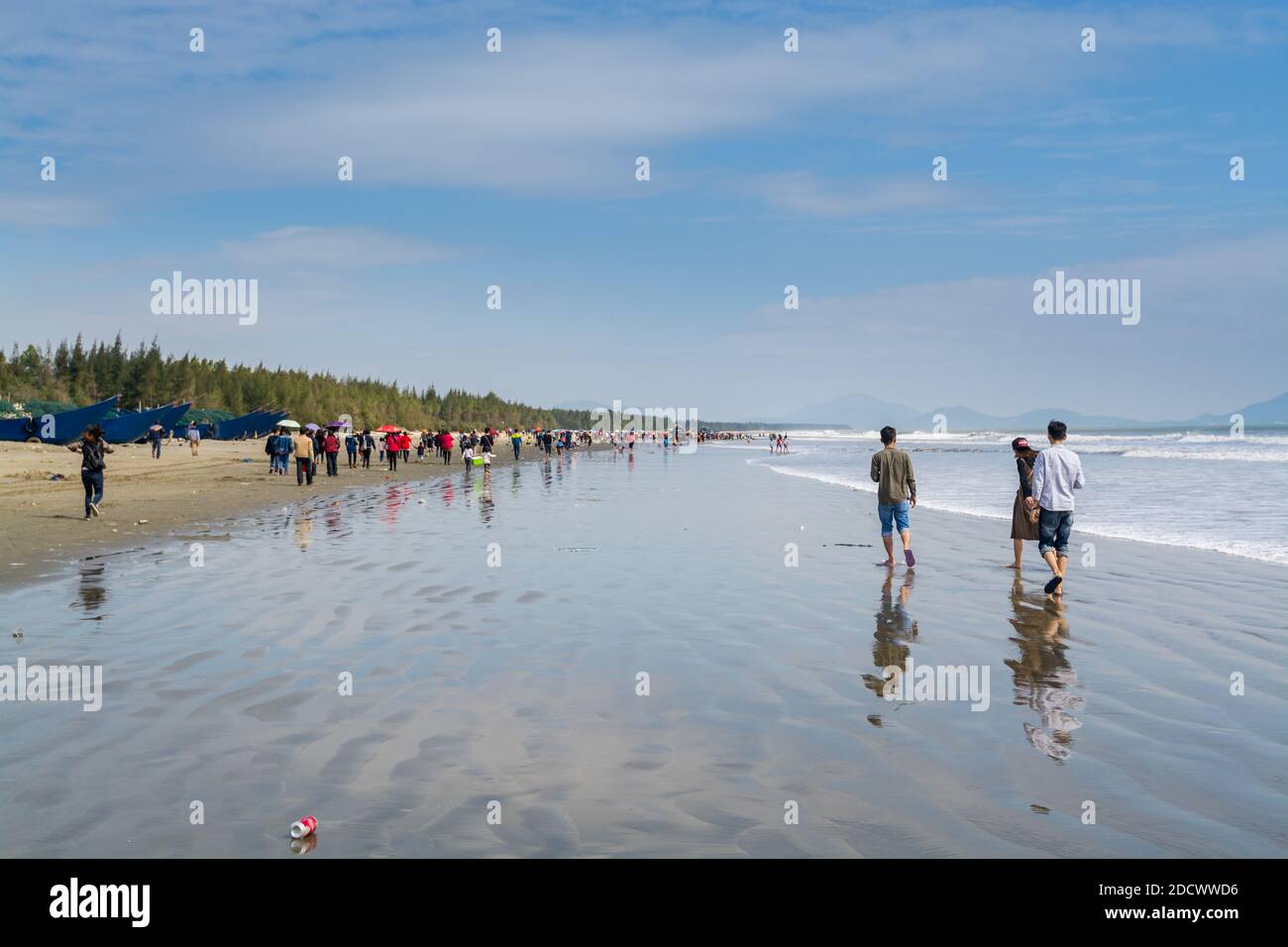 Tourist walking at the beach in Yangxi, Yangjiang, Guangdong, China ...