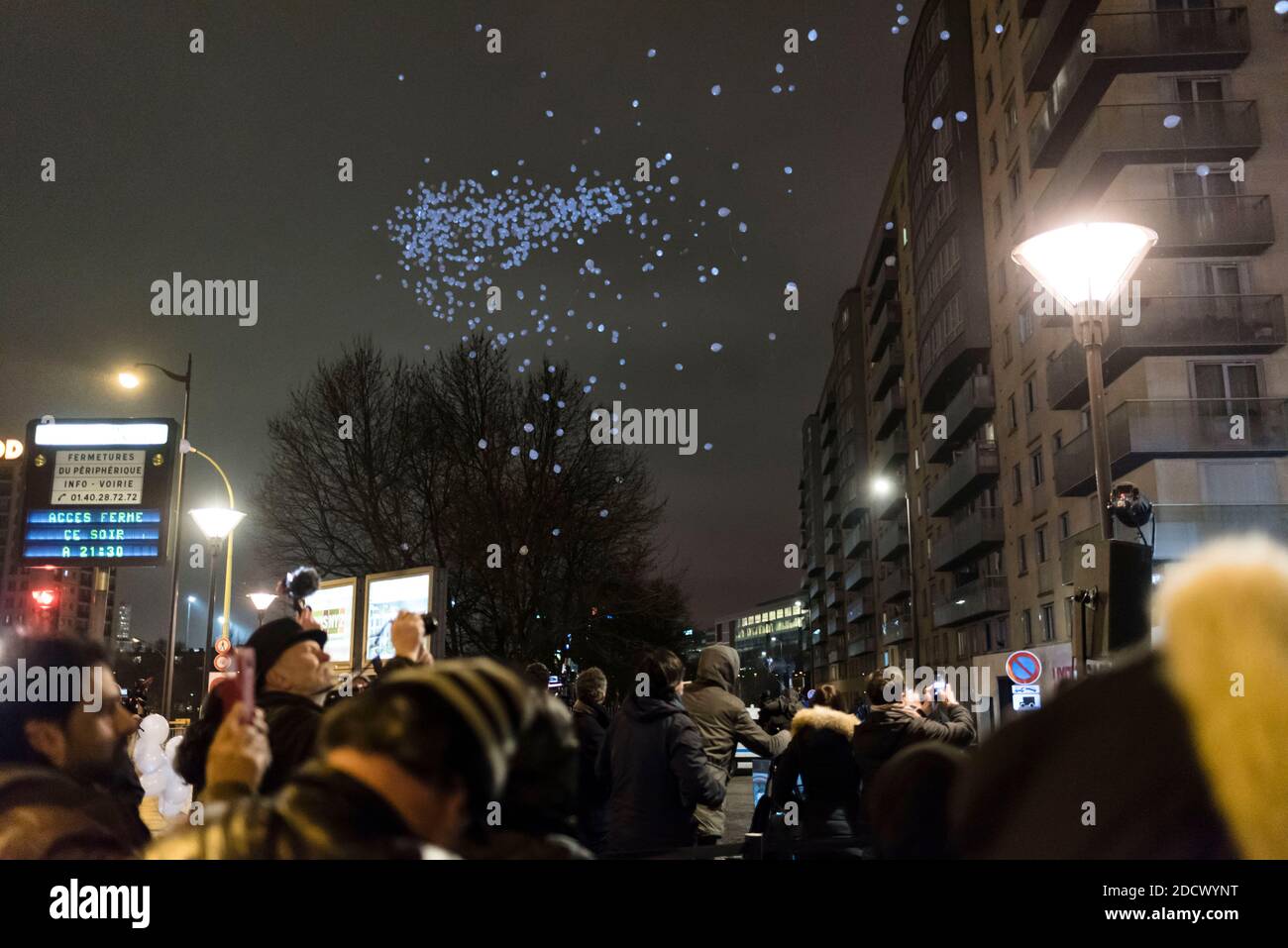 Dozens of people gathered in front of the Hyper Cacher store in the ...