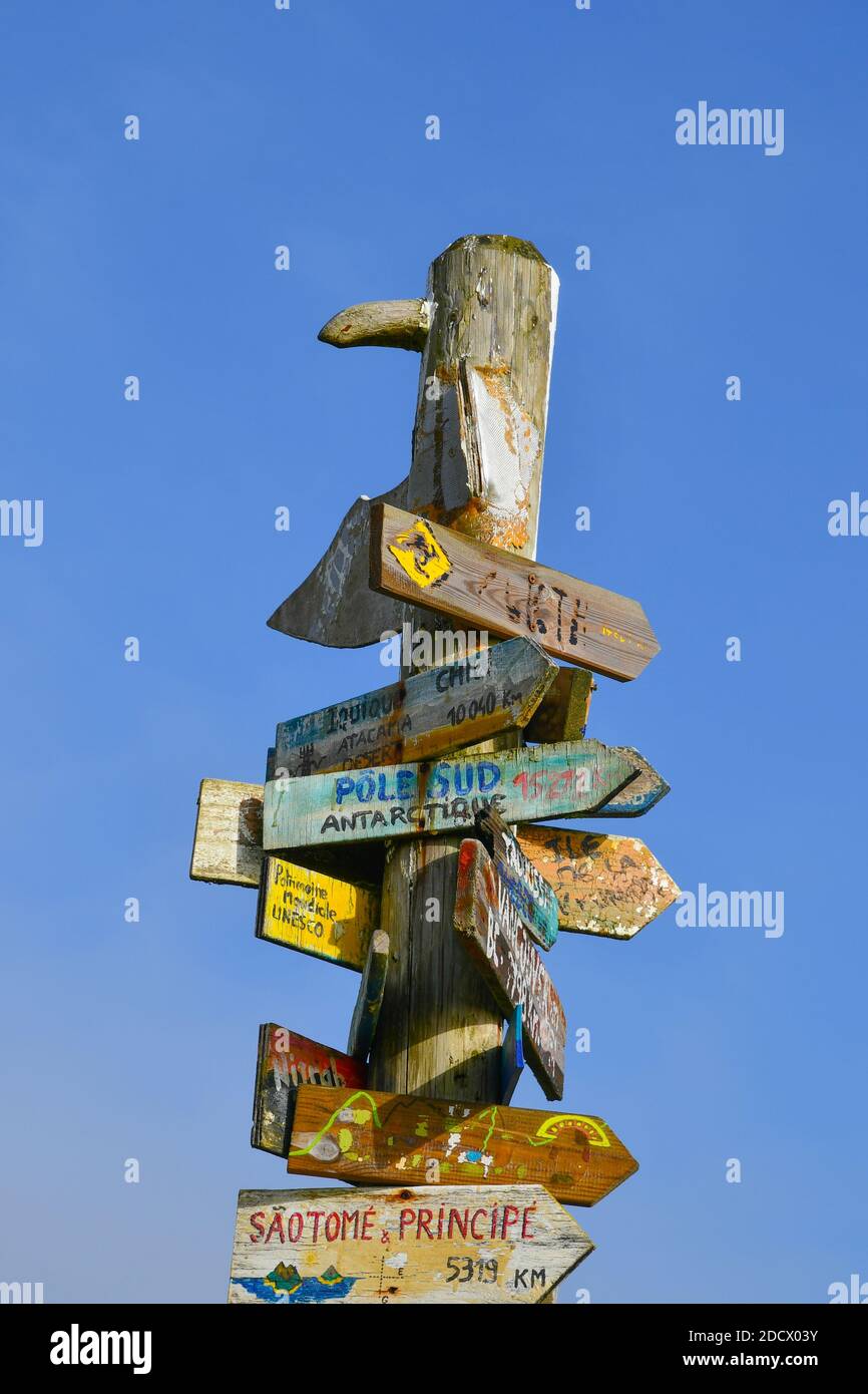 Directional totem on blue sky background Stock Photo - Alamy