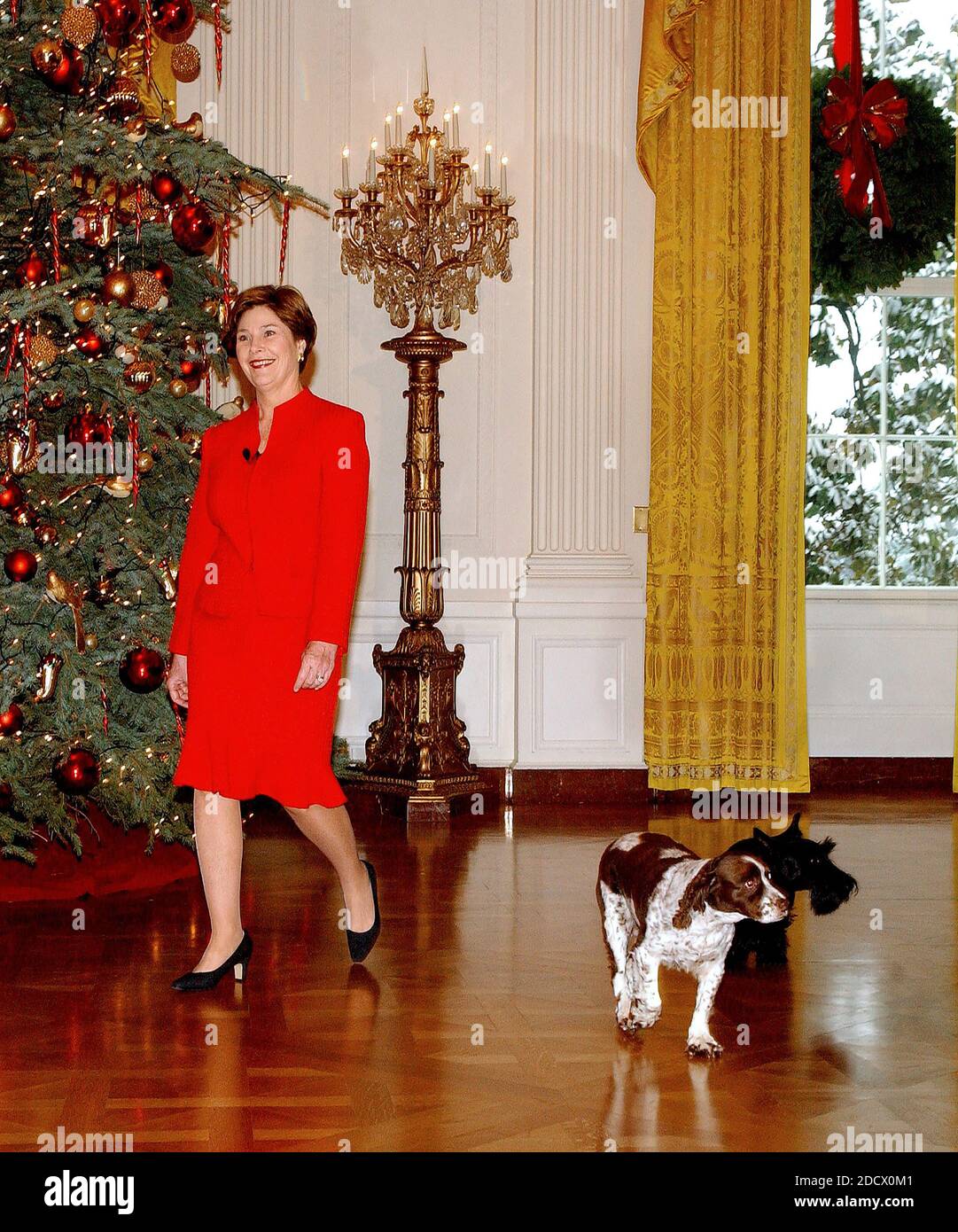 First lady Laura Bush enters the East Room of the White House in ...