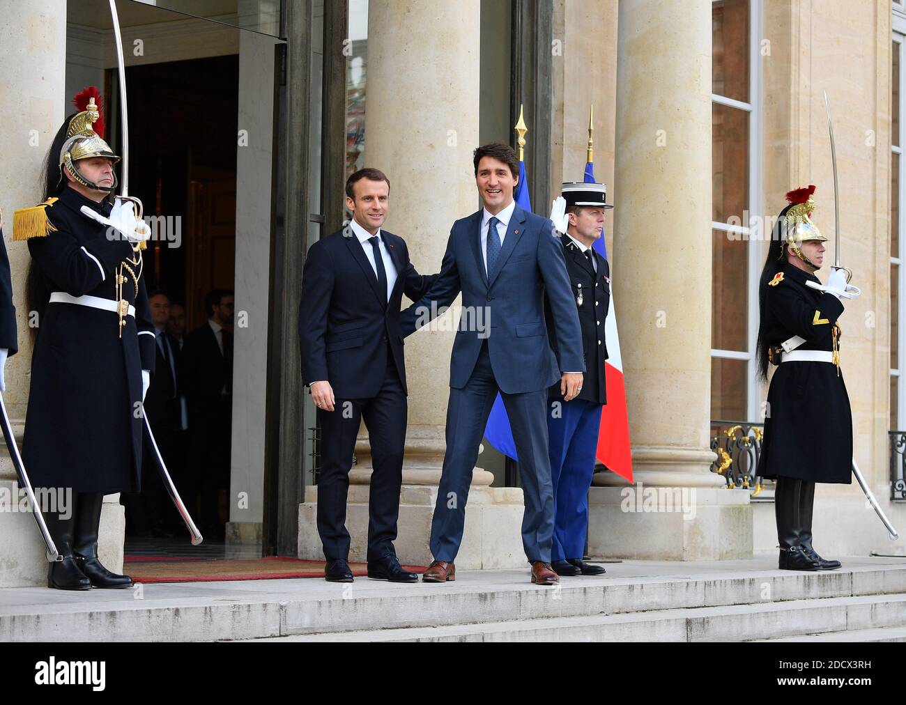 French President Emmanuel Macron greets Canada's President Justin ...