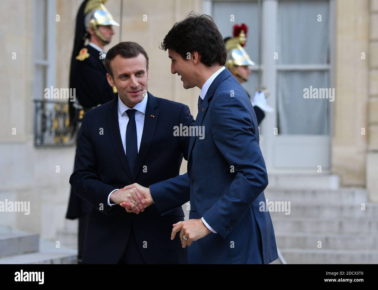 French President Emmanuel Macron greets Canada's President Justin ...