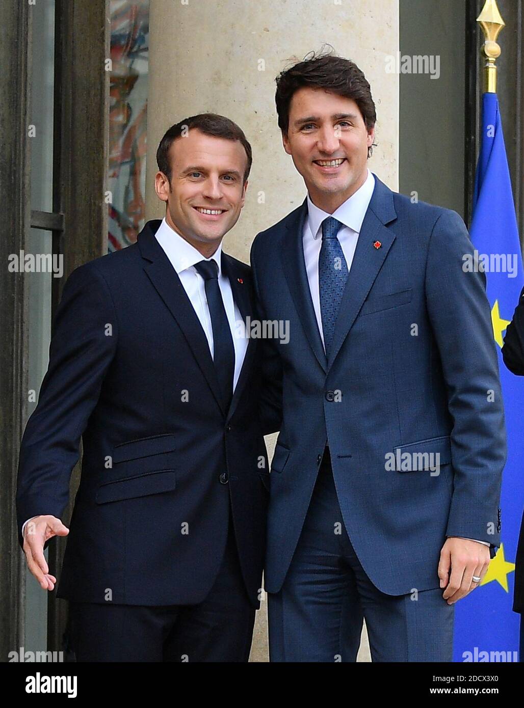 French President Emmanuel Macron greets Canada's President Justin ...
