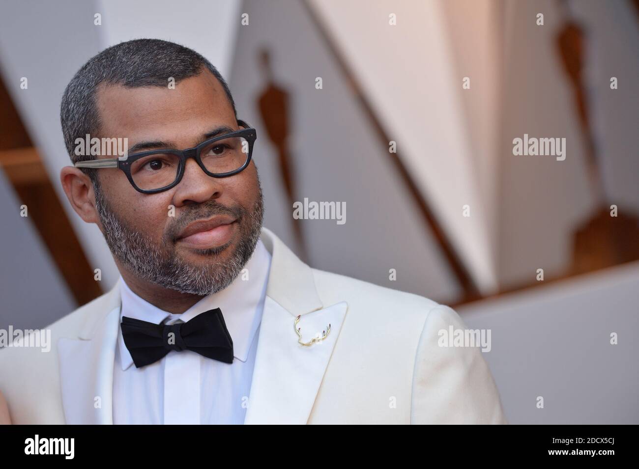 Jordan Peele walking the red carpet as arriving to the 90th annual ...