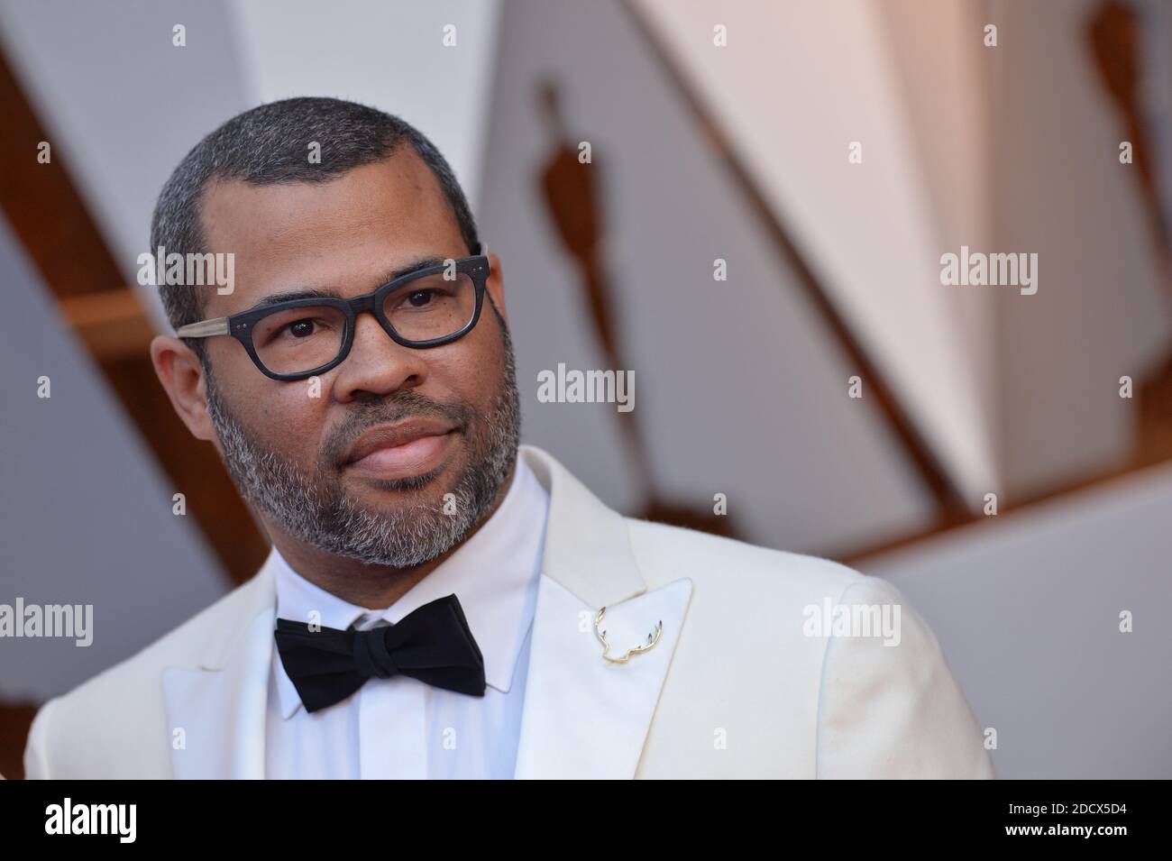 Jordan Peele walking the red carpet as arriving to the 90th annual ...