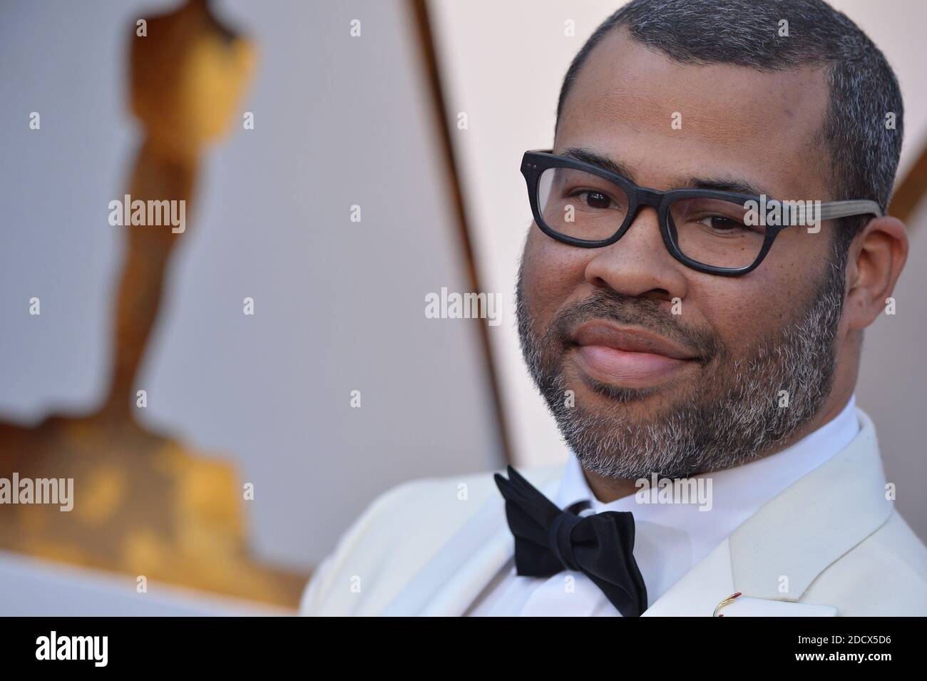 Jordan Peele walking the red carpet as arriving to the 90th annual ...