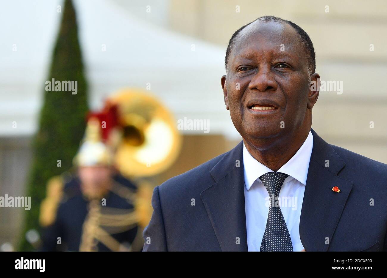 Ivory Coast's President Alassane Ouattara leaving after a meeting with ...