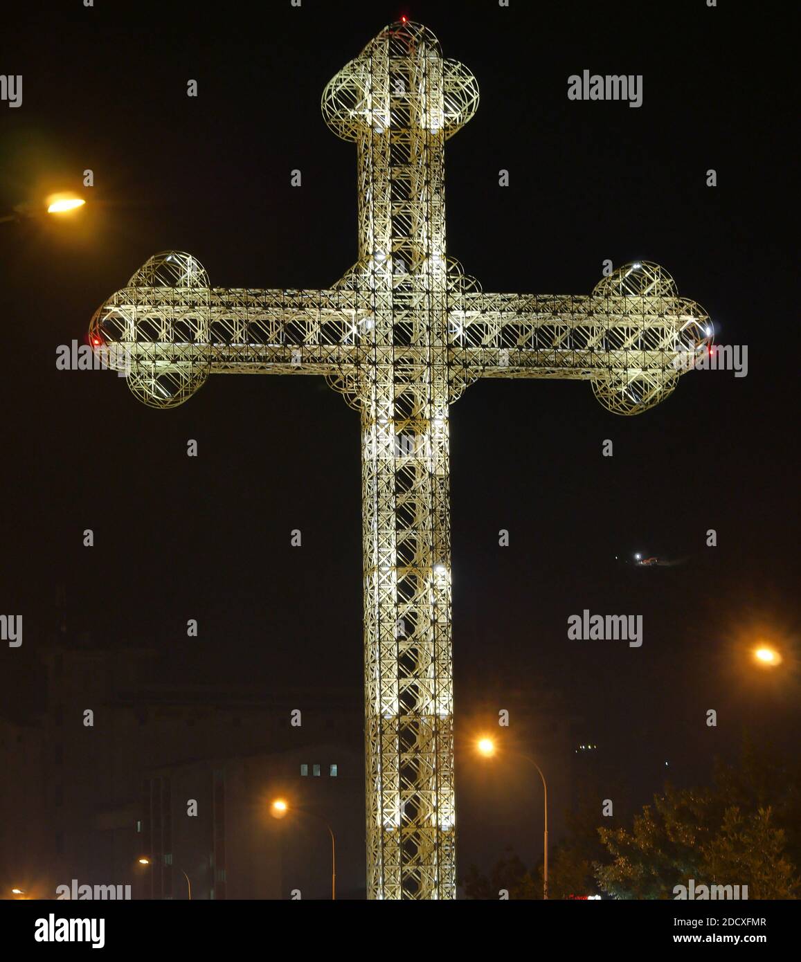 Orthodox cross light in night at city Stock Photo - Alamy