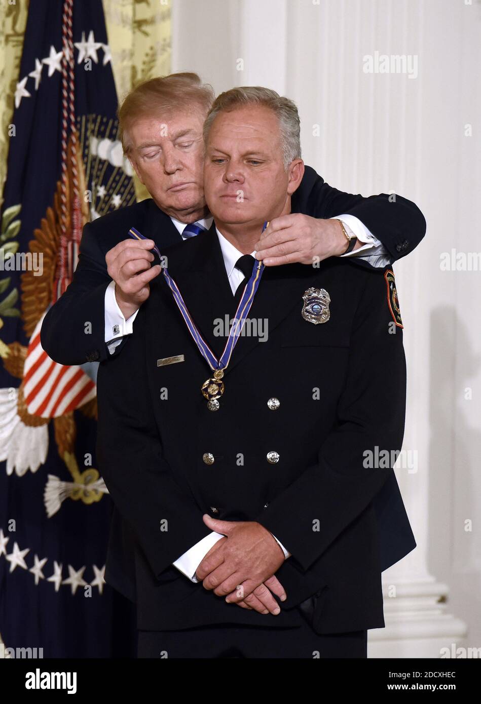 U.S. President Donald Trump (L) presents the Public Safety Medal of ...
