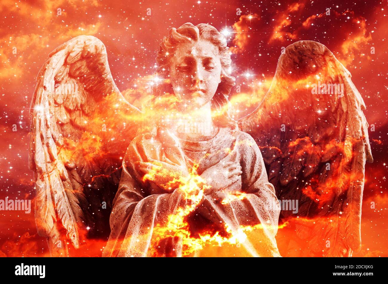 praying angel statue and mystical sky Stock Photo - Alamy