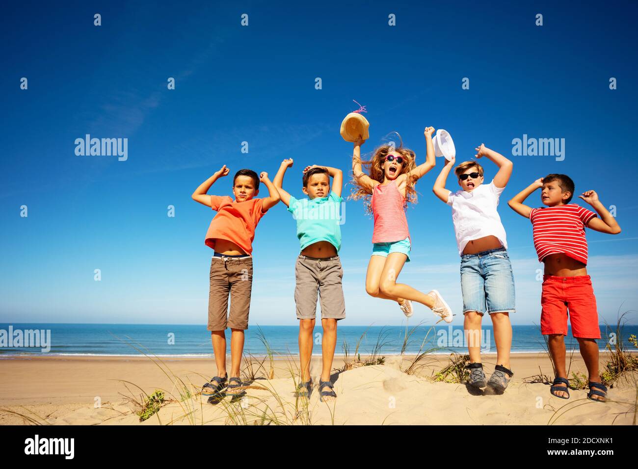 Children jumping into sea hi-res stock photography and images - Alamy