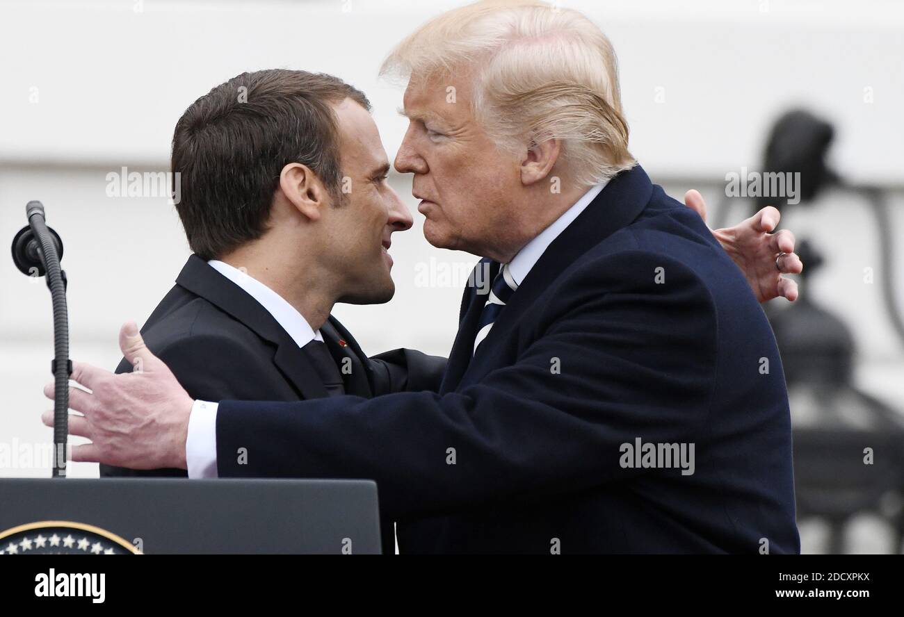 French President Emmanuel Macron hugs with US President Donald Trump ...