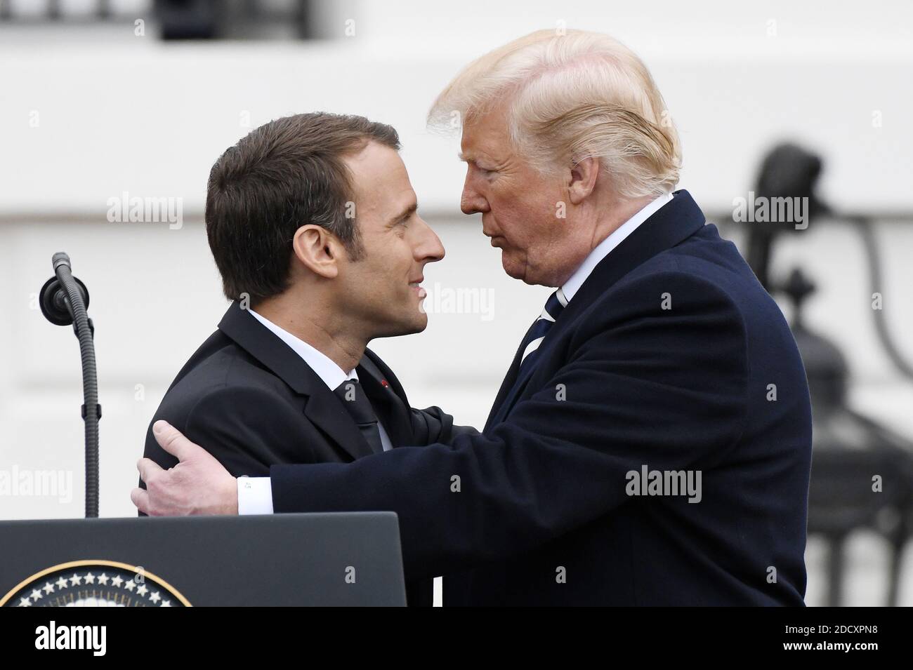 French President Emmanuel Macron hugs with US President Donald Trump ...