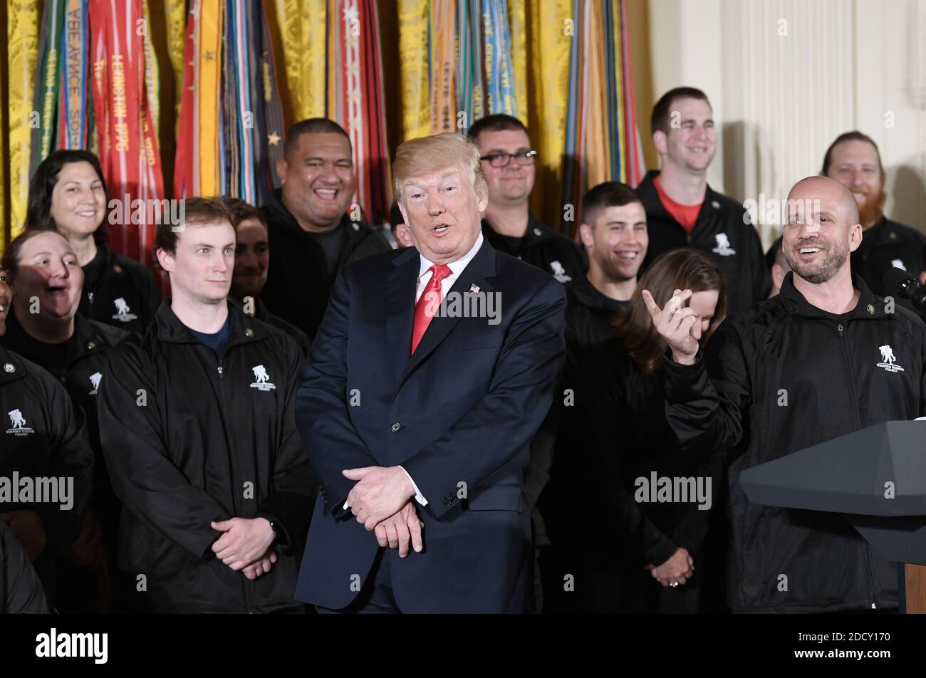 US President Donald Trump listens to retired US Army Staff Sargeant Dan ...
