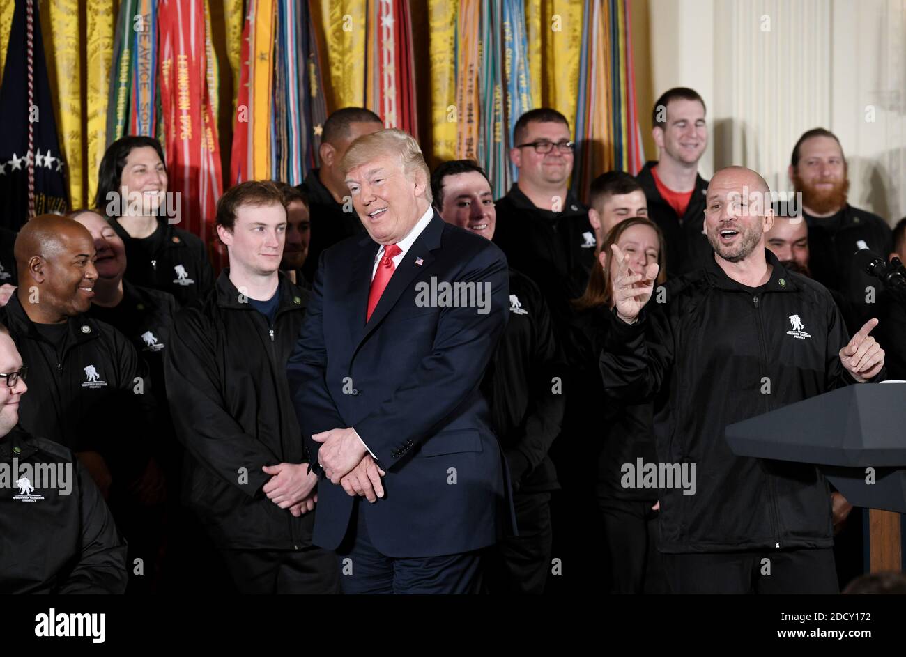 US President Donald Trump listens to retired US Army Staff Sargeant Dan ...