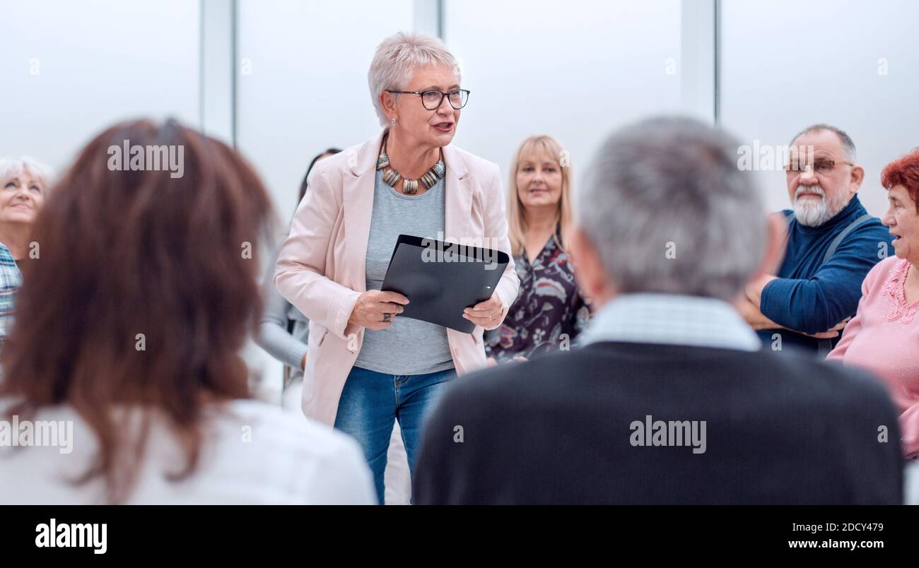 old lady teaches old people Stock Photo - Alamy