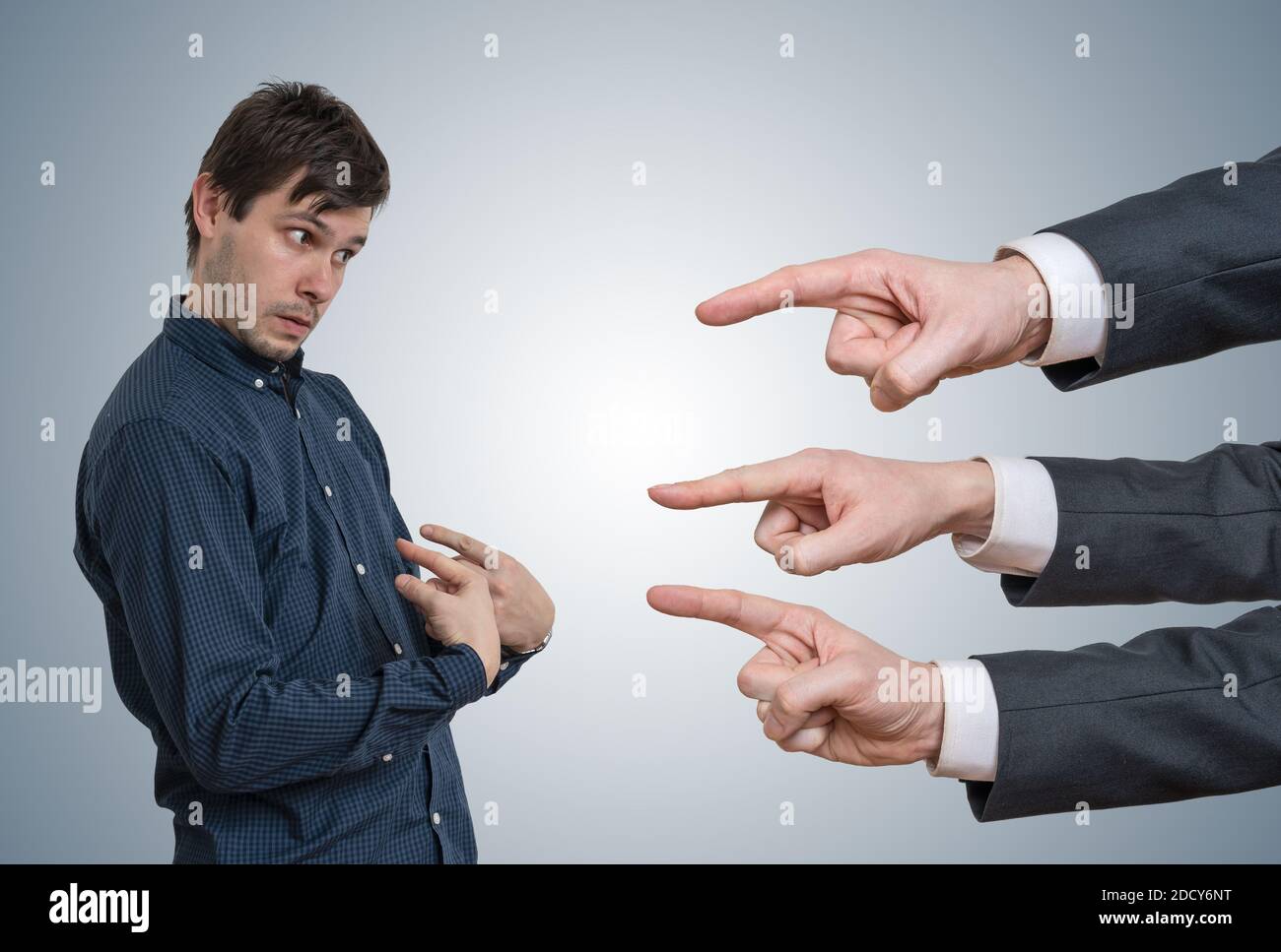 Young employee get fired. Many hands are blaming him Stock Photo - Alamy