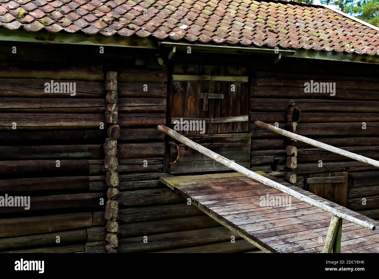 Abandoned old Nordic barn with a wagon bridge. Made from old timber ...