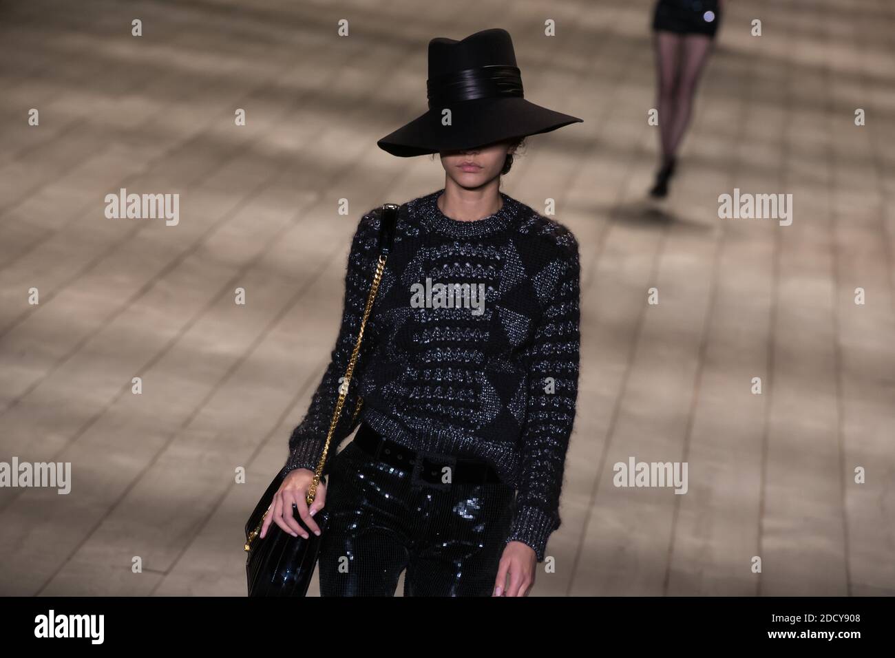 A model walks the runway YSL (Yves Saint Laurent) Womenswear Fall ...
