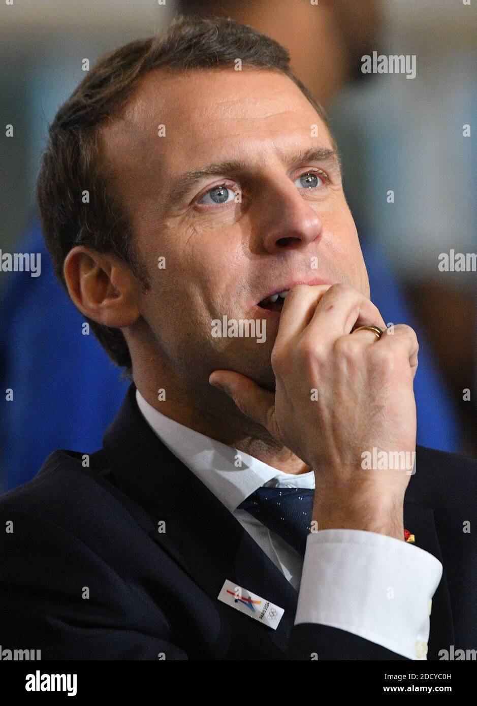 French President Emmanuel Macron watches children practise basketball ...