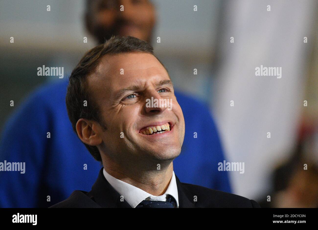 French President Emmanuel Macron watches children practise basketball ...
