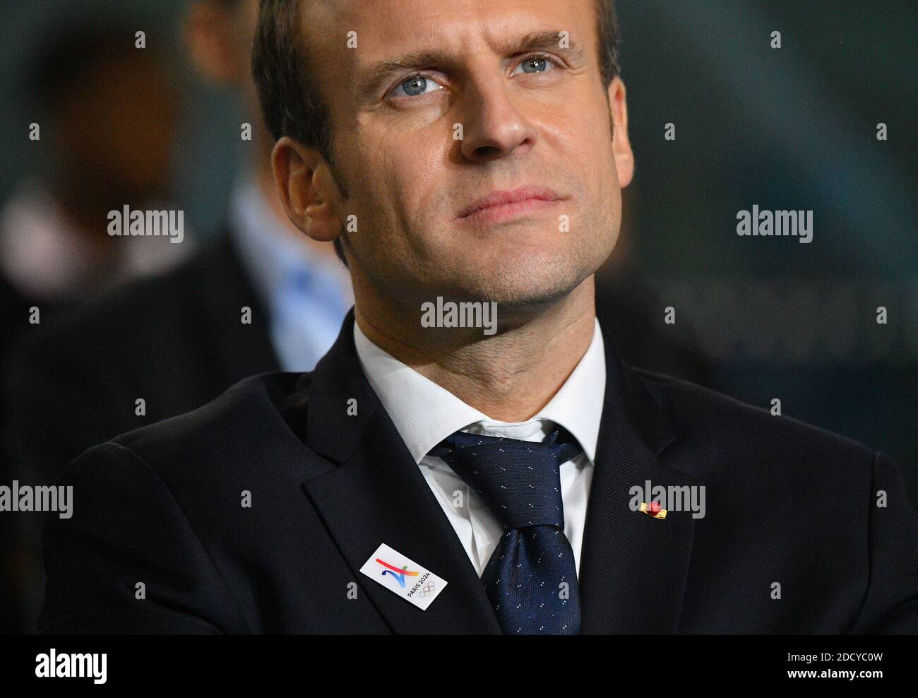 French President Emmanuel Macron watches children practise basketball ...