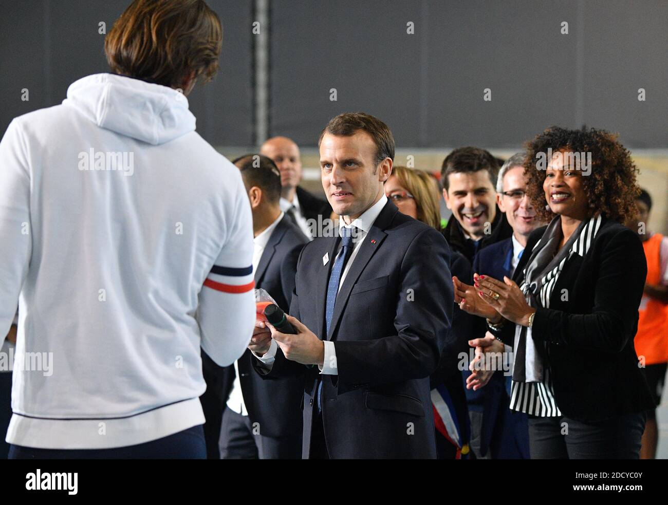 French President Emmanuel Macron watches children practise basketball ...