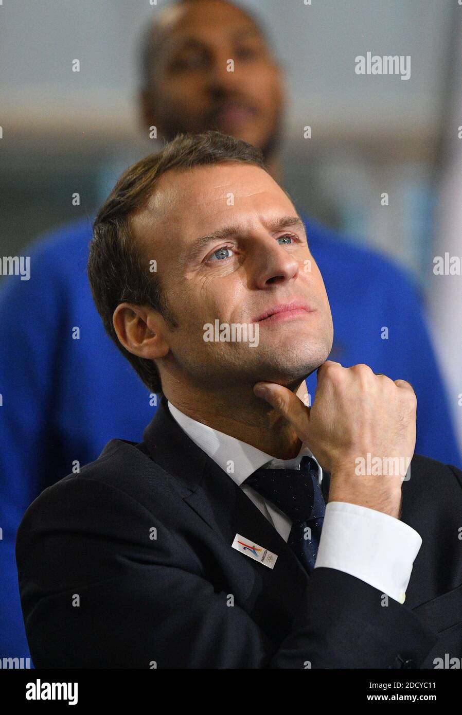 French President Emmanuel Macron watches children practise basketball ...