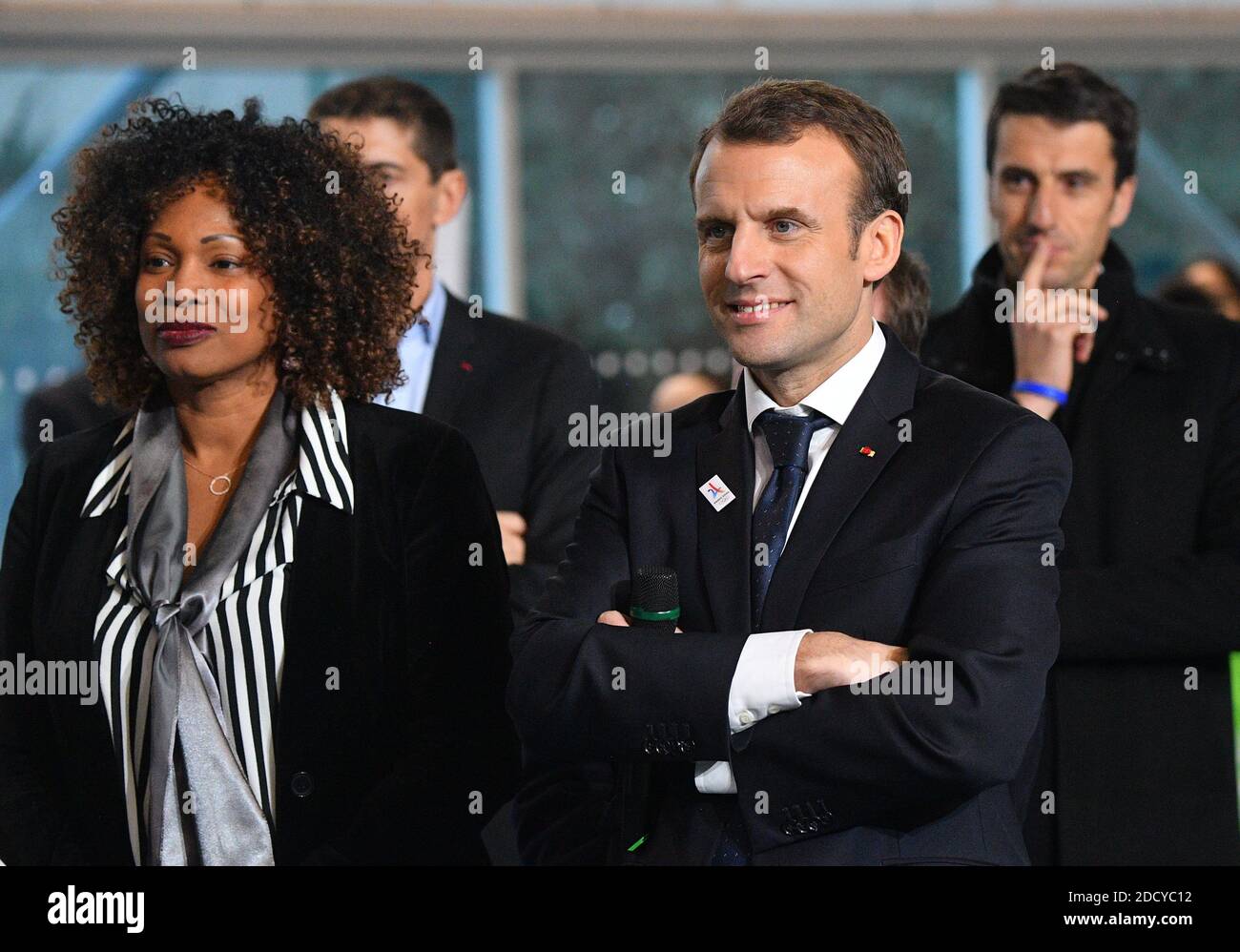 French President Emmanuel Macron watches children practise basketball ...