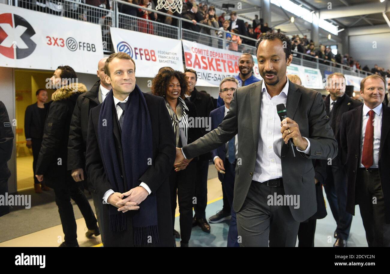 French President Emmanuel Macron watches children practise basketball ...