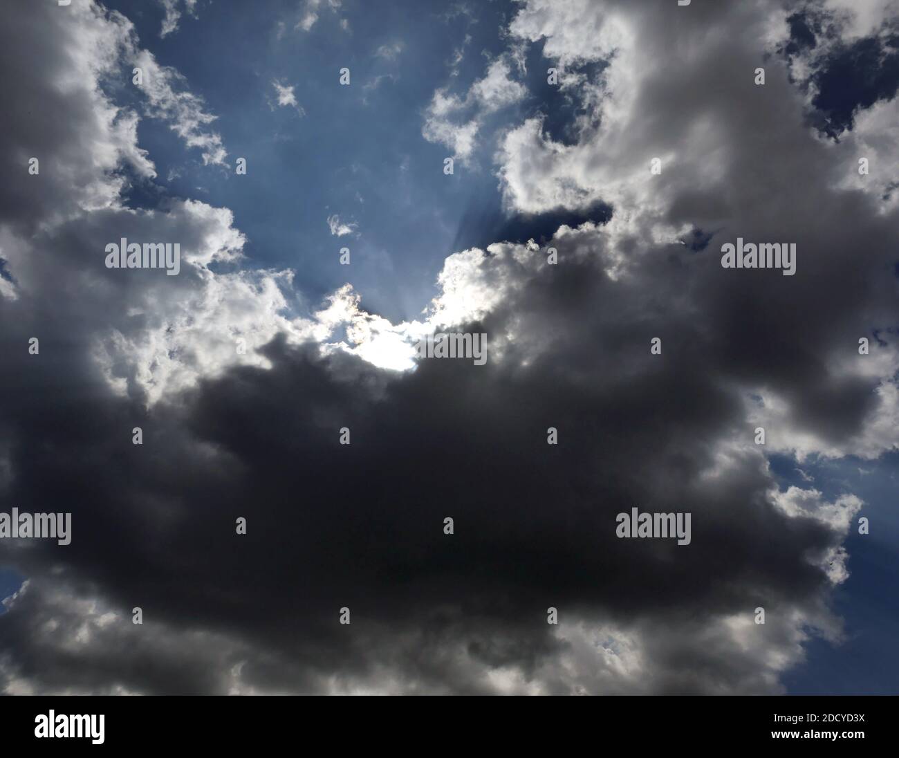 Beautiful clouds blue sky sun ray natural background Stock Photo - Alamy