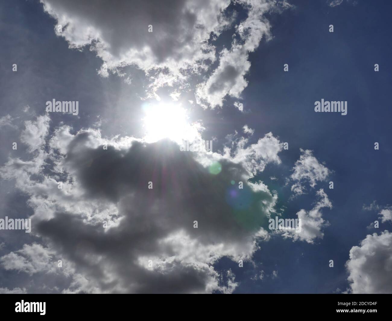 Beautiful clouds blue sky sun ray natural background Stock Photo - Alamy