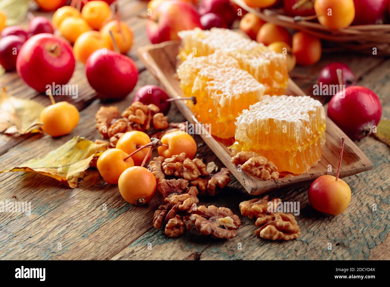 Honey, walnuts and ripe small wild apples. Red and yellow crab apples ...