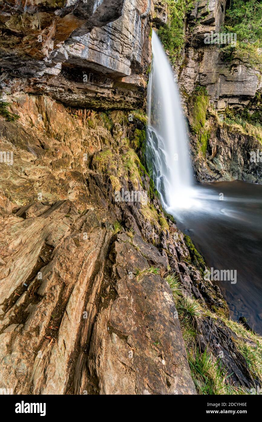 Flowing waterfall with interesting limestone rocks at Thornton Force in ...