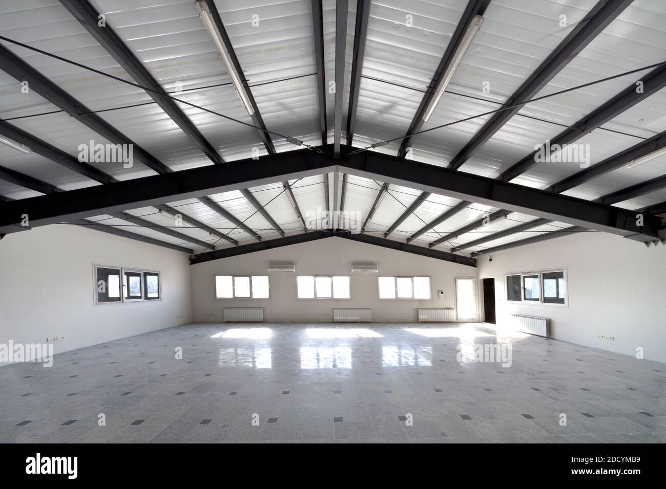 Empty hangar for storage of equipment Stock Photo - Alamy