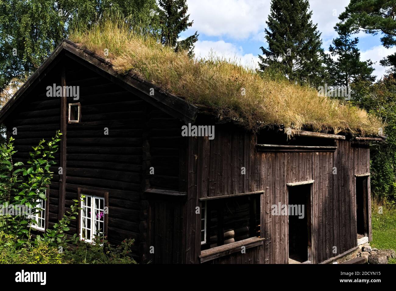 Old medieval farm house with green grass turf roof Stock Photo - Alamy
