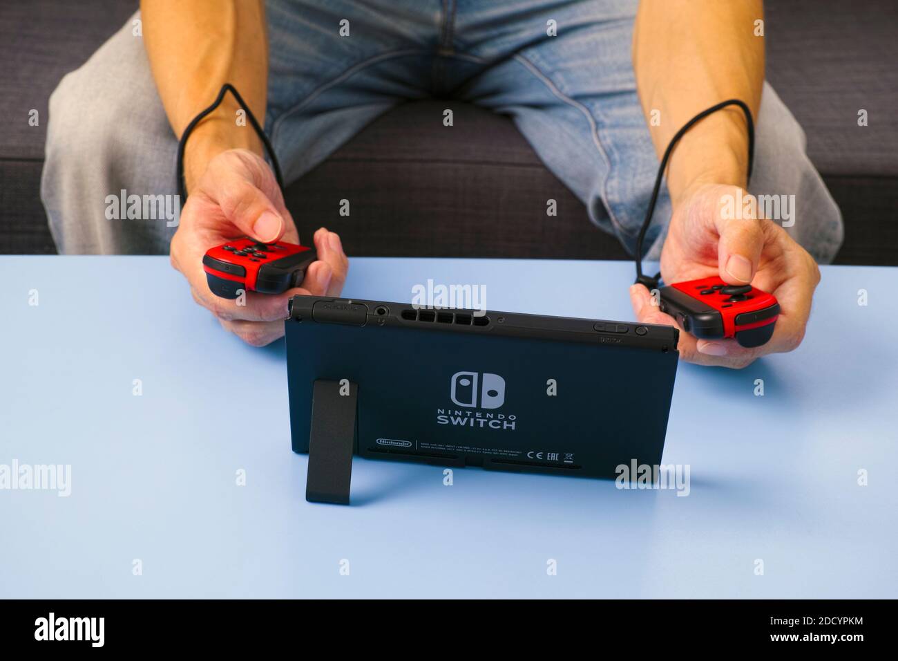Tambov, Russian Federation - June 22, 2019 Man playing Nintendo Switch ...