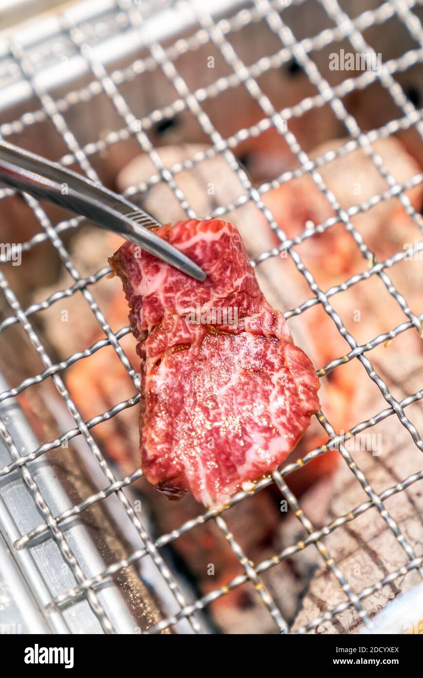grilled japanese wagyu premium beef yakiniku with red hot charcoal ...