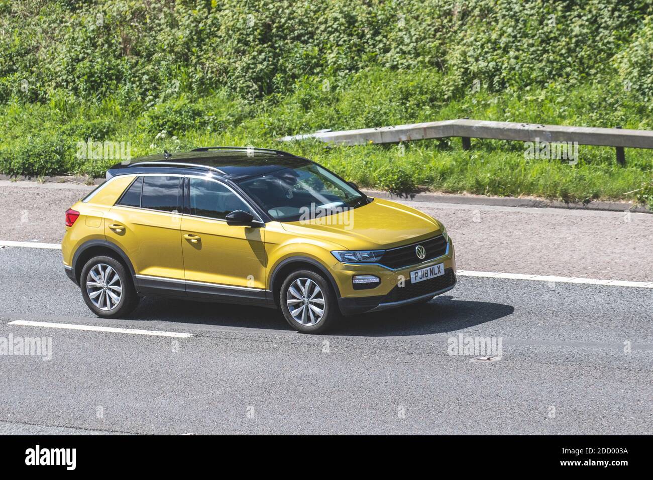 2018 yellow Volkswagen T-Roc Design TSI EVO; Vehicular traffic, moving ...