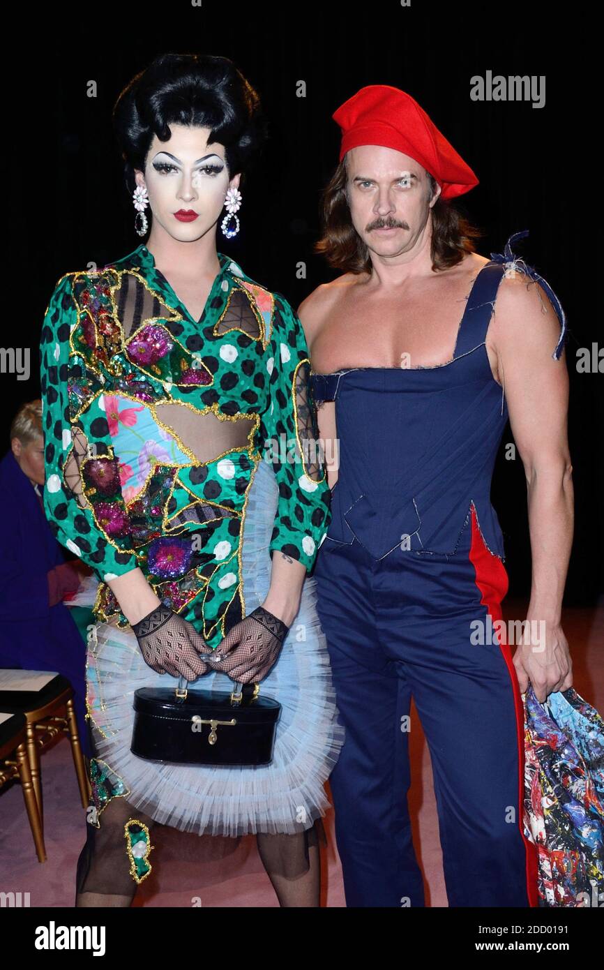 Casey Spooner and guest attending the Viktor and Rolf show as part of ...