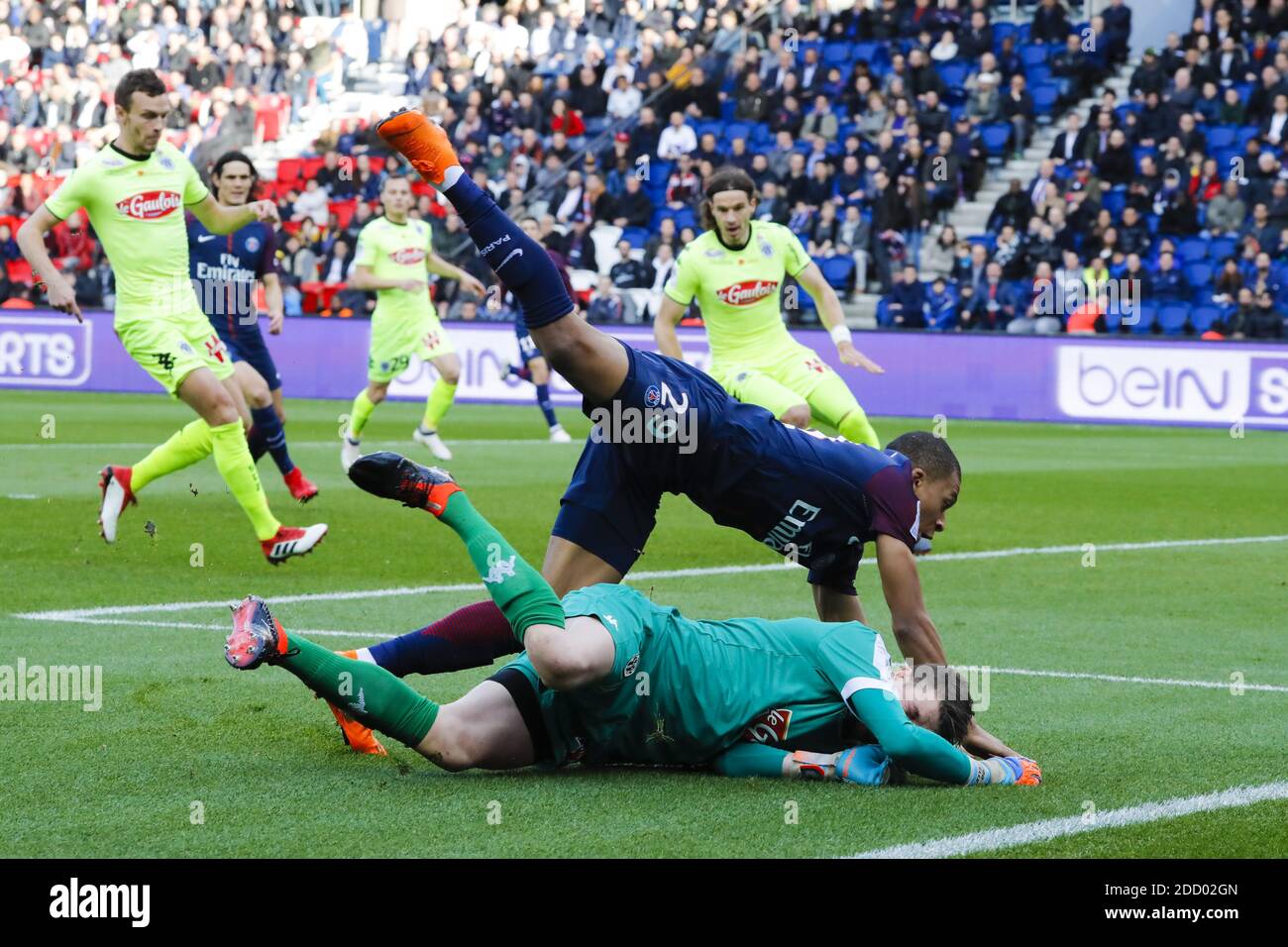 PSG's Kylian Mbappe battling Angers's Ludovic Butelle during the French ...