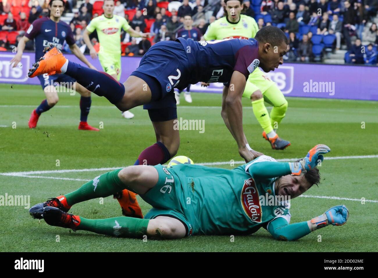 PSG's Kylian Mbappe battling Angers's Ludovic Butelle during the French ...