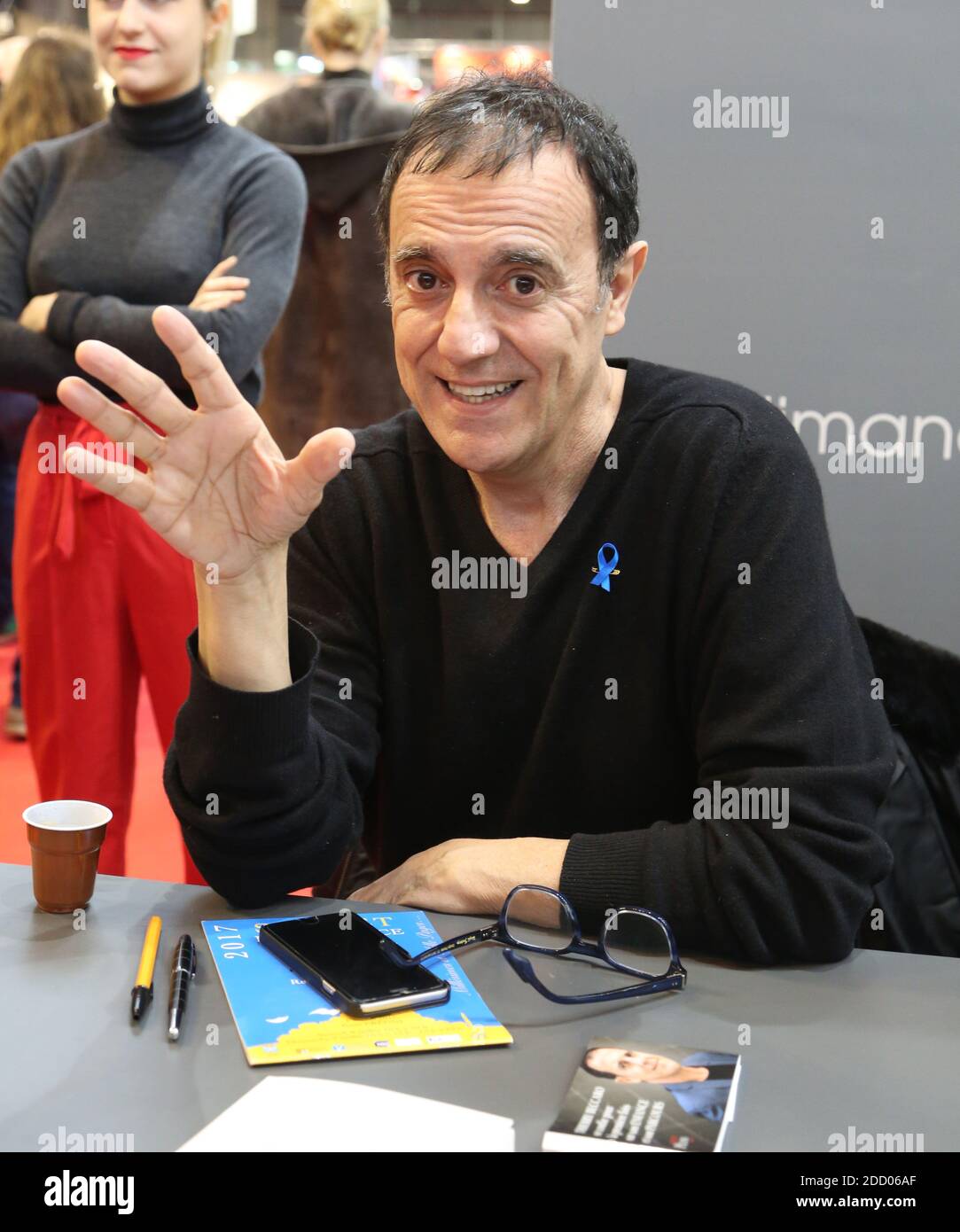 French stage actor and tv presenter Thierry Beccaro signs during the ...