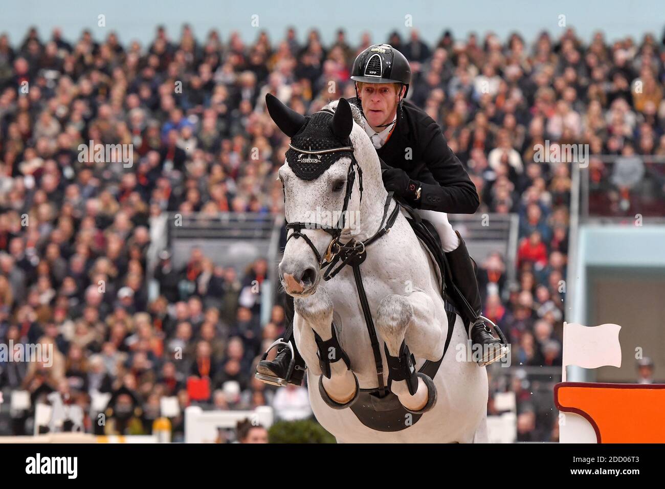 Marcus Ehning, of Germany, on Cornado competes during the Saut Hermes ...