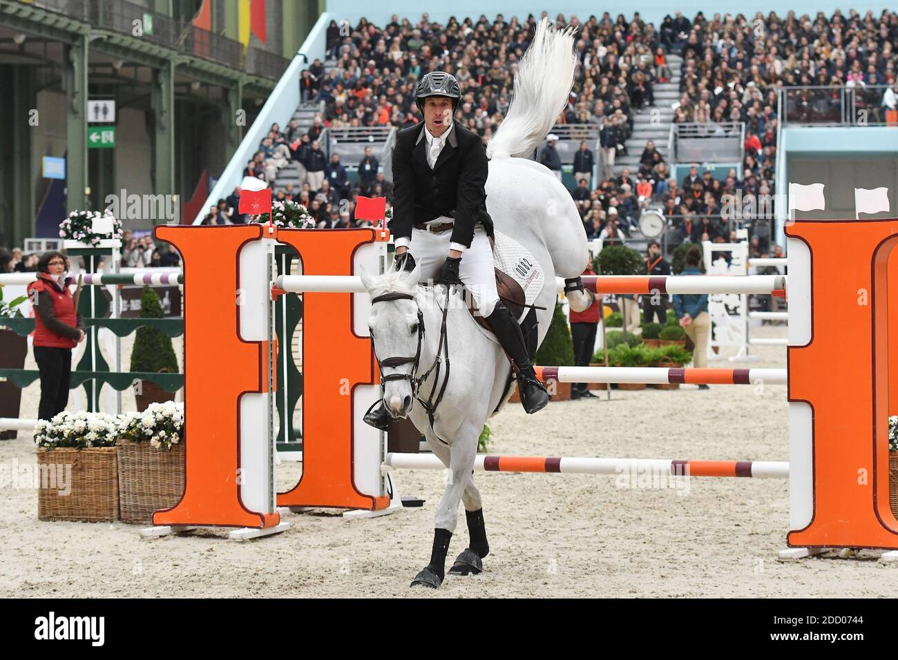 Andrew Kocher, of Usa, on Navalo De Poheton competes during the Saut ...