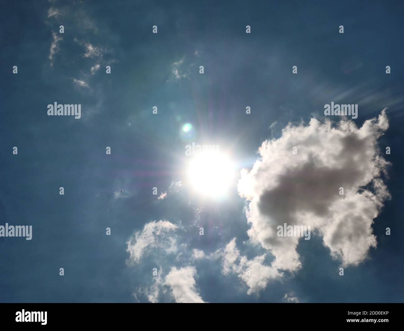 clouds blue sky sun ray natural background Stock Photo - Alamy