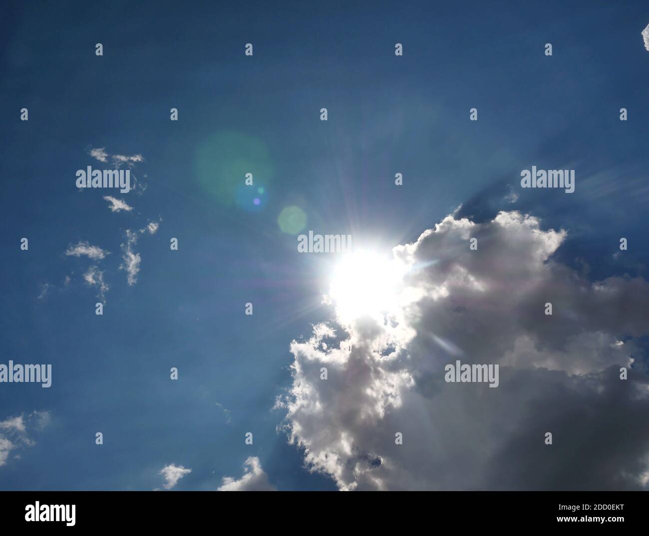 clouds blue sky sun ray natural background Stock Photo - Alamy