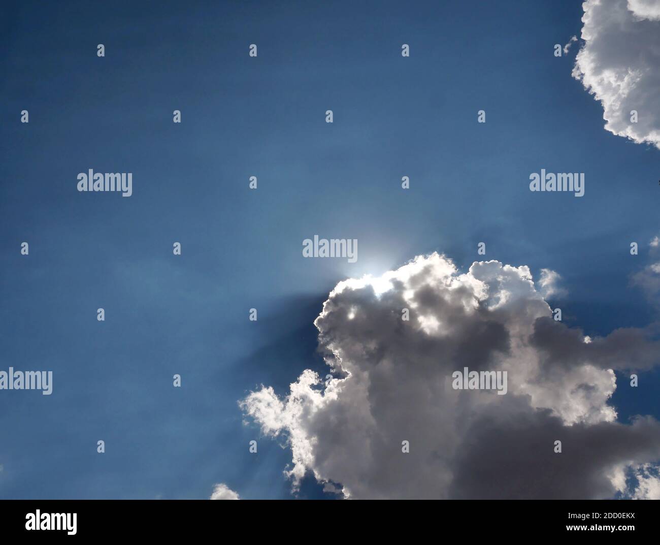 clouds blue sky sun ray natural background Stock Photo - Alamy